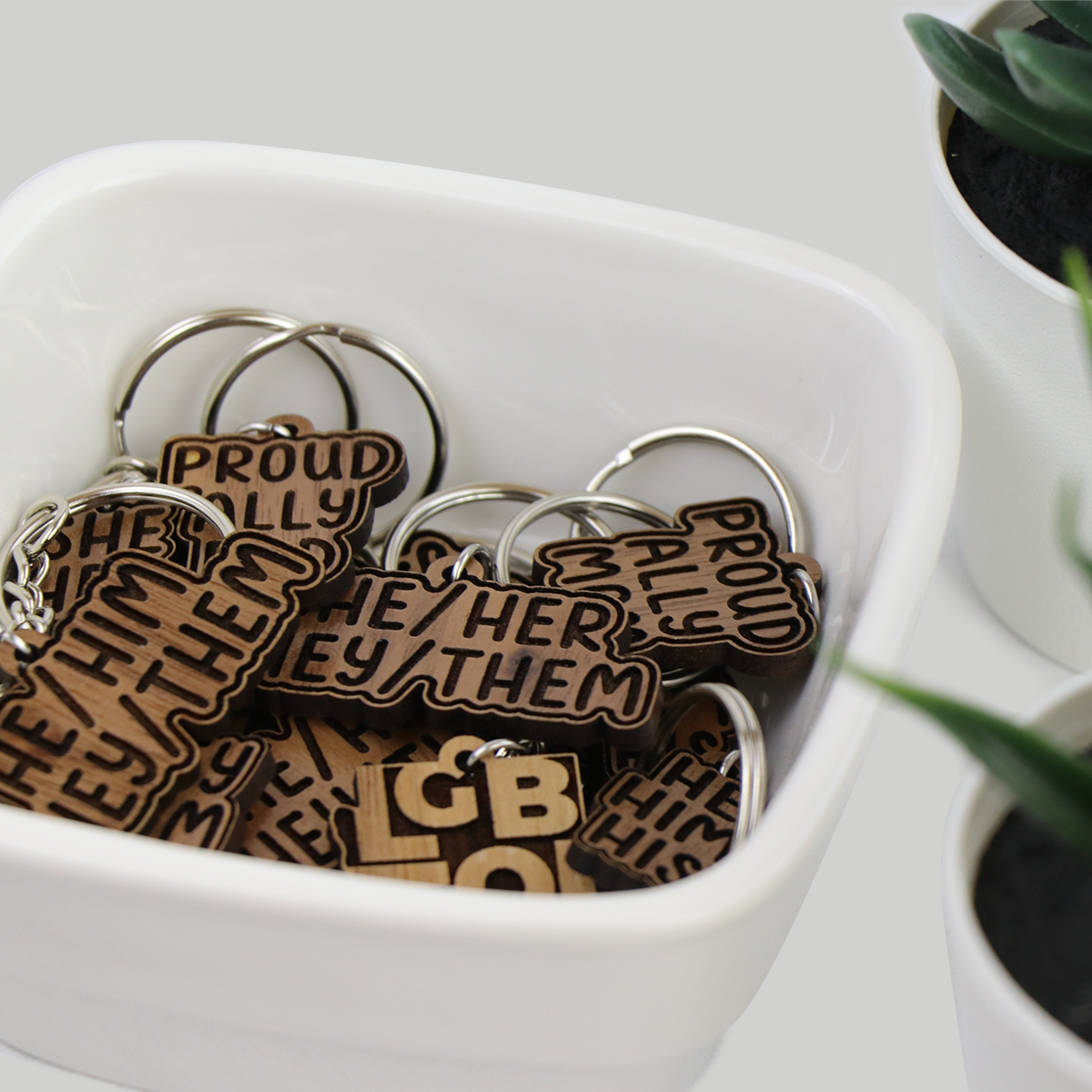 Laser Cut Pronoun Pins + Keychains | Our Family Designs